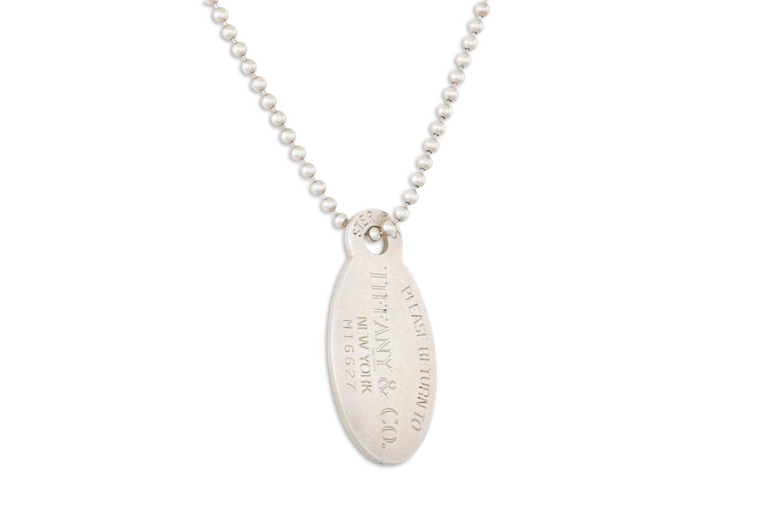 Lot 115 - A TIFFANY SILVER PENDANT, in a box