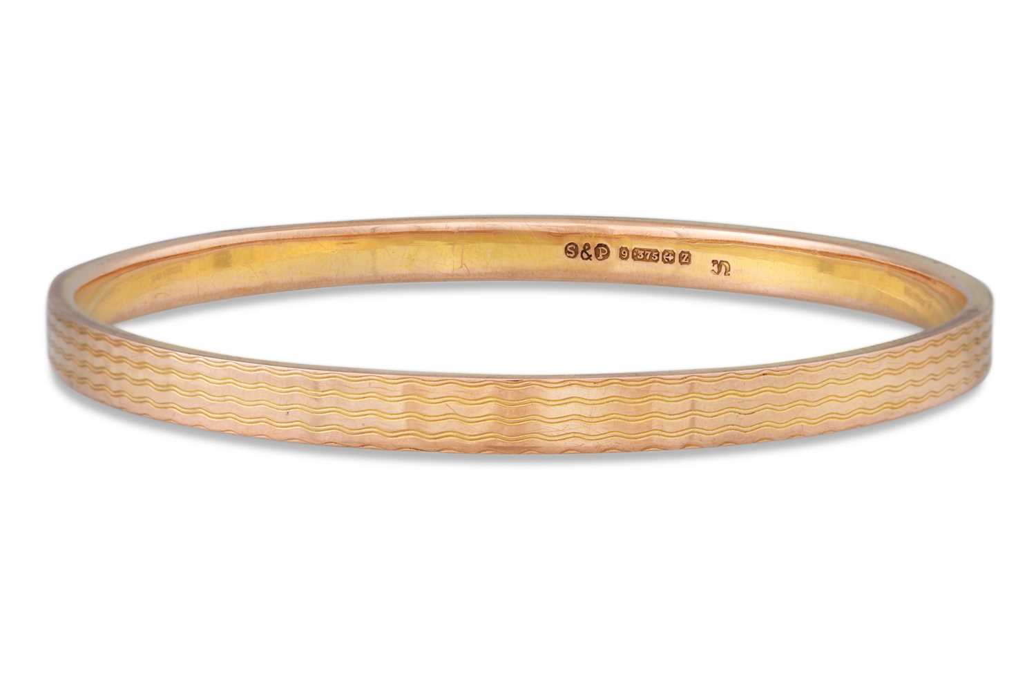Lot 104 - A 9CT GOLD BANGLE, hallmarked Birmingham
