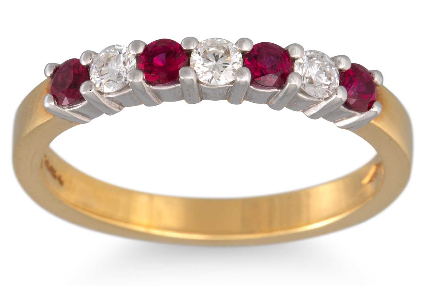 Lot 354 - A DIAMOND AND RUBY SEVEN STONE RING, mounted