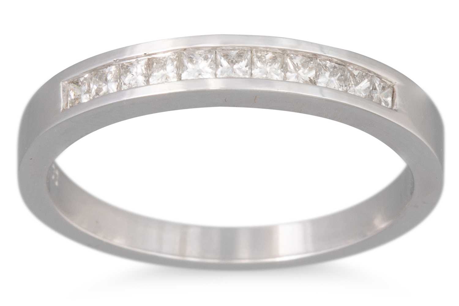 Lot 104 - A CHANNEL SET DIAMOND RING, the princess cut