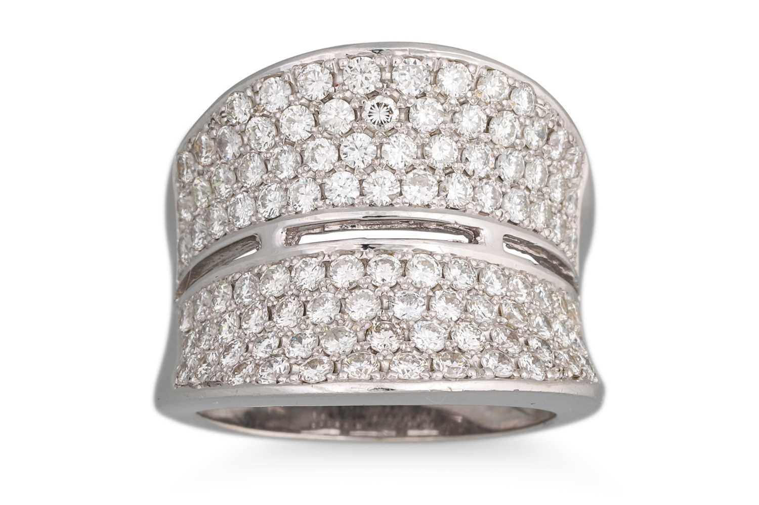Lot 214 - A CONCAVE DIAMOND RING, pavé set with